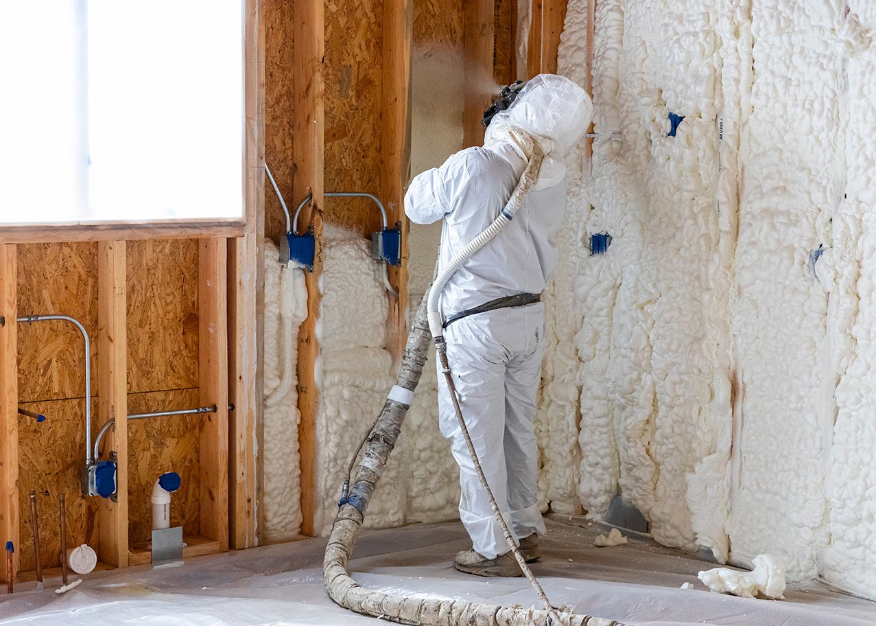 Why Foam Insulation Crews Wear Suits and What It Means for Your Safety